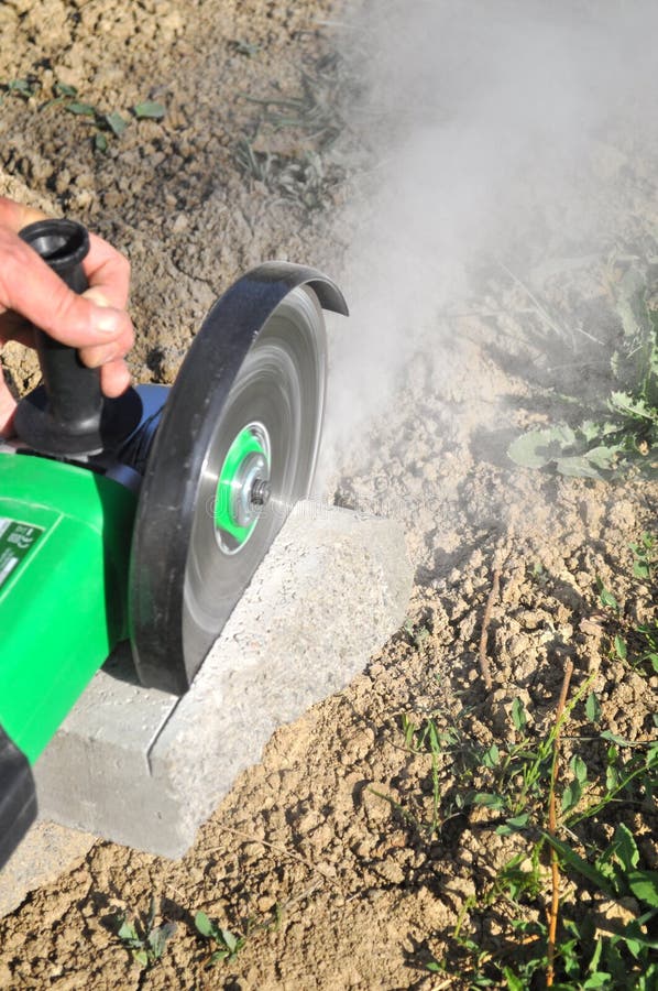 Person Cutting a Piece of Concrete Stock Image - Image of construction ...