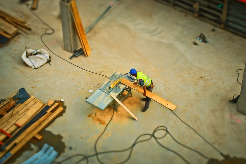 Person Cutting Wood On Table Saw During Daytime Picture. Image: 88562780