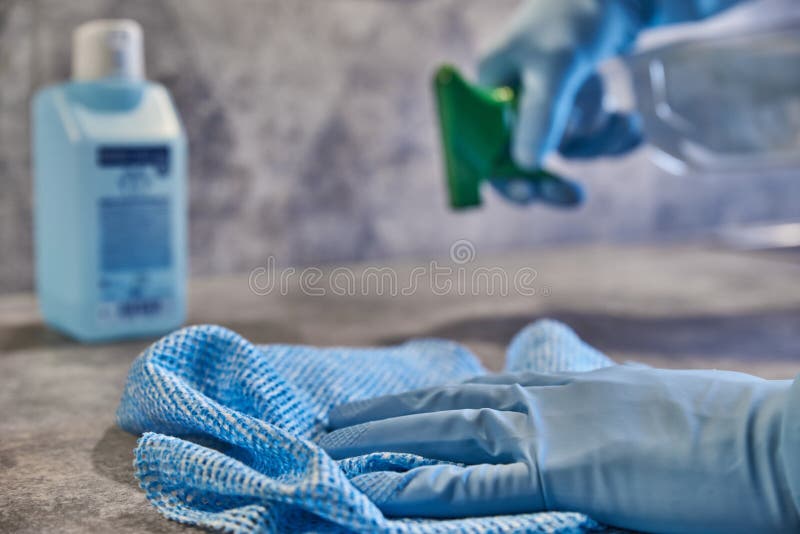 Person Disinfecting a Surface with Disinfectant. Cleaning a Surface ...