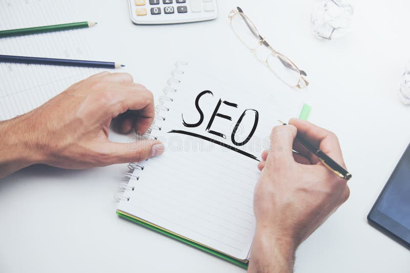 Person Drawing SEO Concept on White Paper in the Office Stock Photo ...