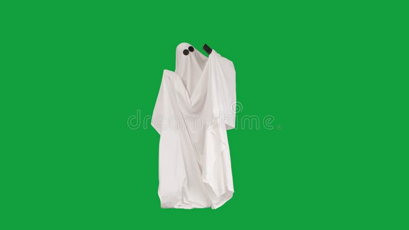 Halloween Ghost in White Sheet Takes Selfie on Smartphone Posing at ...
