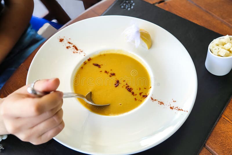 Person Eating Bowl of Soup with a Spoon Stock Image - Image of steam ...