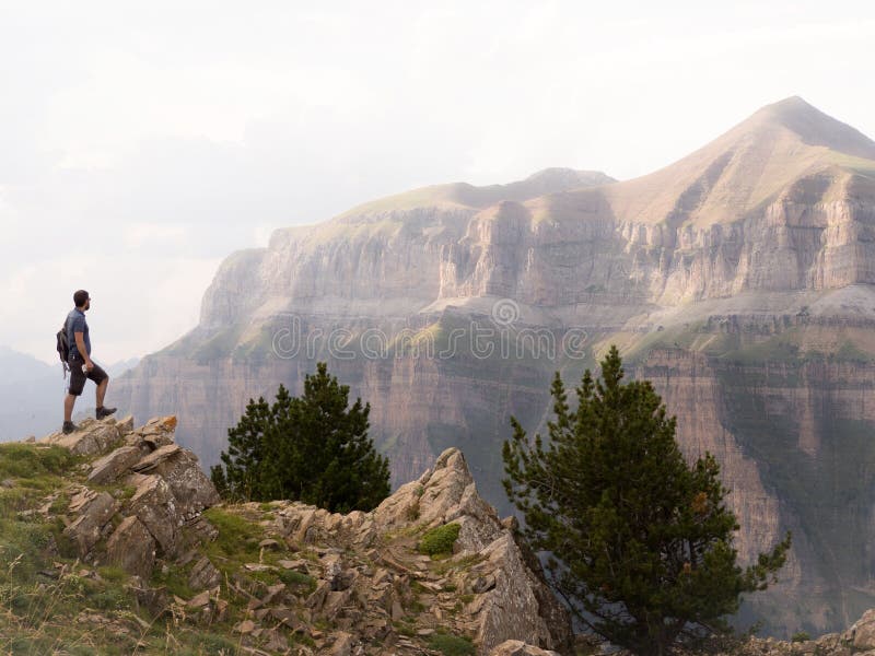 Person on the Edge of a Cliff Looking at the Mountains in the Pyrenees ...