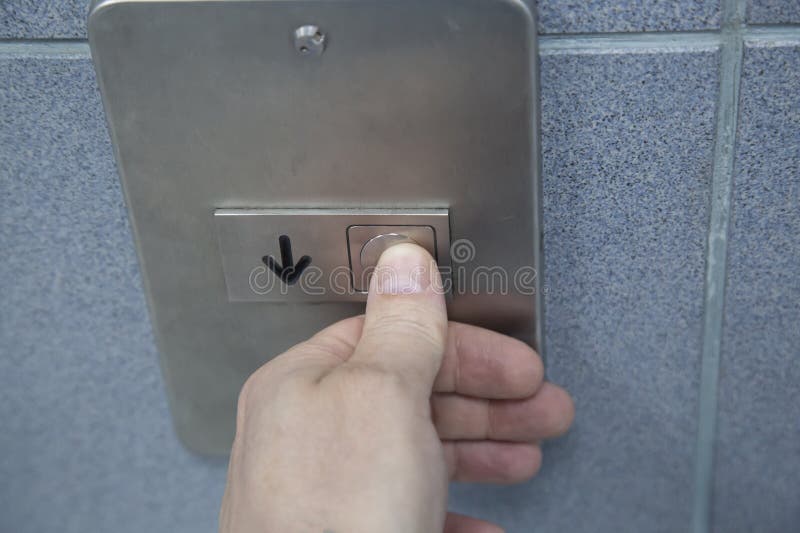 The Person in the Elevator Presses the Button To Start Moving Stock ...