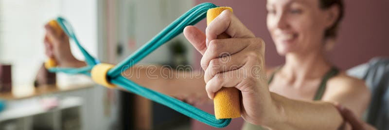 Exercising with Resistance Bands at Home for Strength Training Stock ...