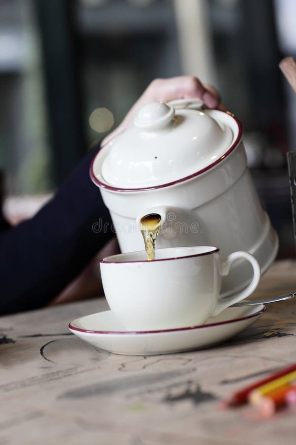 Person filling cup of tea stock image. Image of hand - 49470269