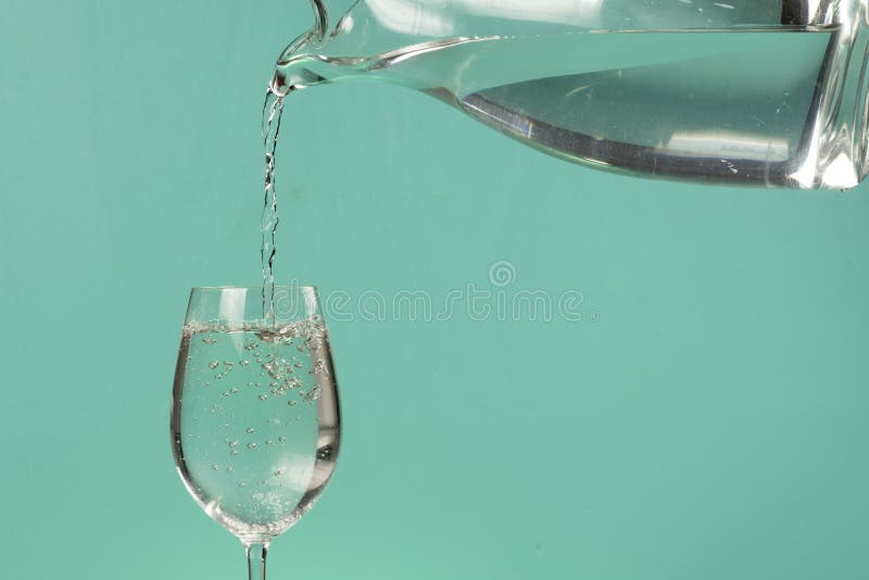 Person Filling a Cup of Water with a Jar Stock Photo - Image of drop ...