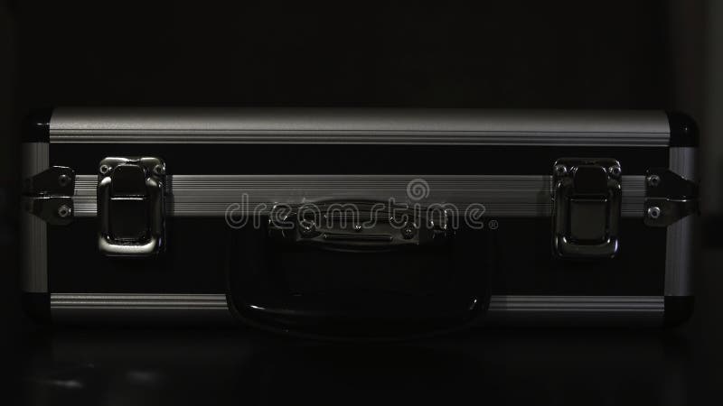 A Person Finding Treasure in Silver Metal Suitcase in a Dark Room ...