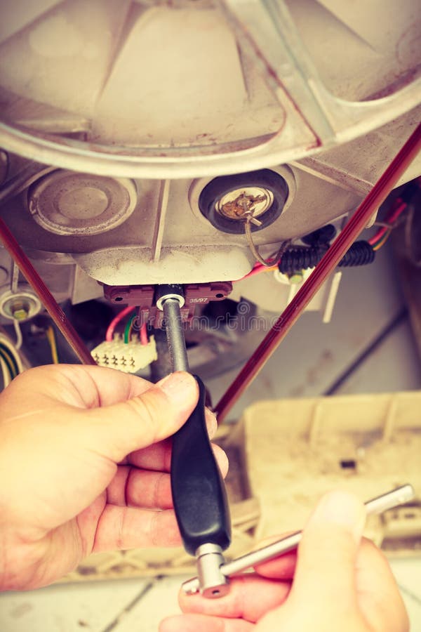 Person Fixing Washing Machine. Stock Image - Image of worker ...