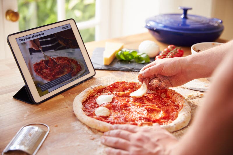 Person Following Pizza Recipe Using App On Digital Tablet Stock Photo ...