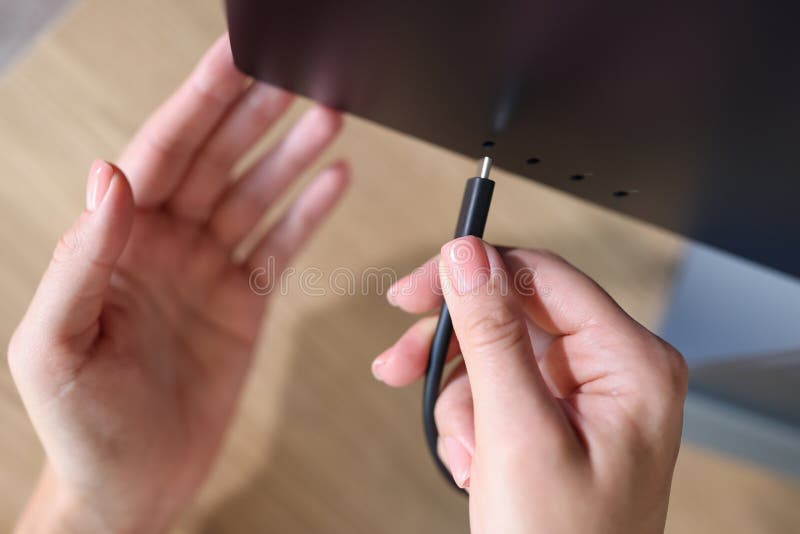 Person Hand Connects a Black USB-C or Type C Power Cable To Computer ...