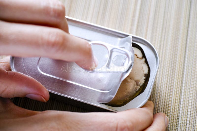 Person Hand Opening Tin Can with Cod Liver Stock Photo - Image of ...