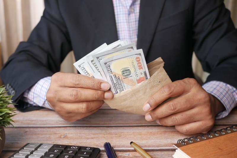Person Hand Putting Cash in a Envelope. Stock Image - Image of finance ...