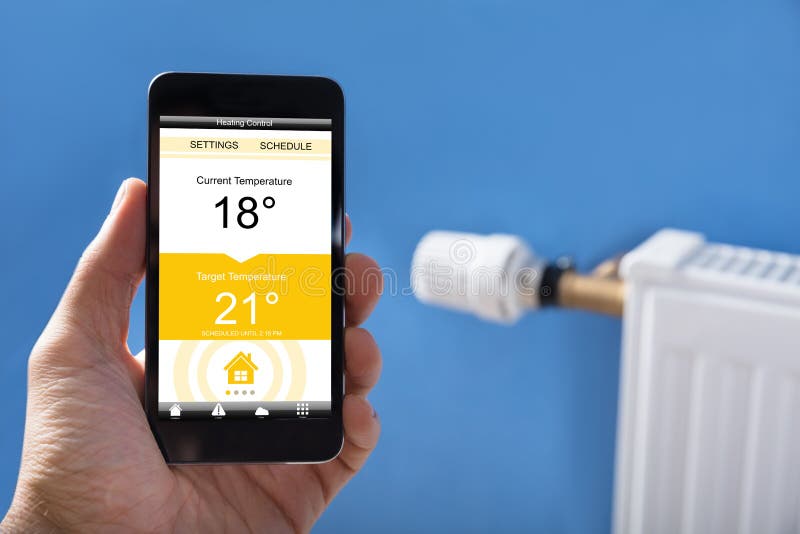 Person Hand Setting Temperature of Thermostat Using Mobilephone Stock ...