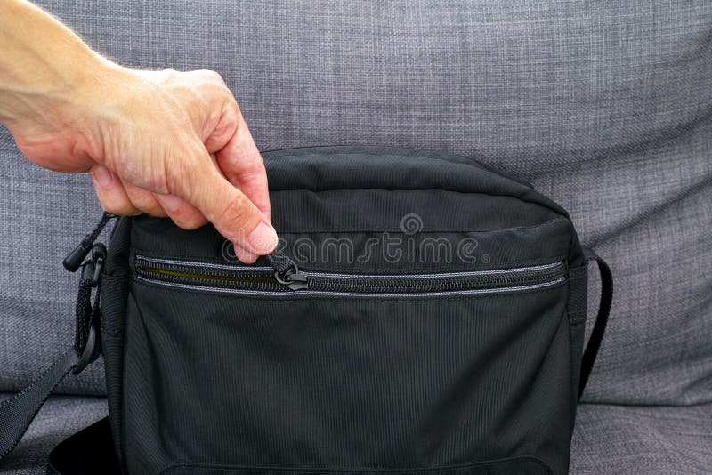 Person Hand Using Zipper on Bag Pocket Stock Image - Image of finger ...