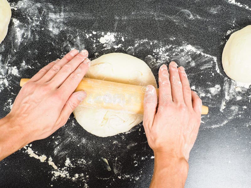 Person Handling a Dough with Wooden Rolling Pin Stock Photo - Image of ...