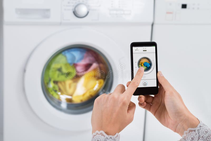 Person Hands Operating Washing Machine Mobile Phone Stock Photos - Free ...