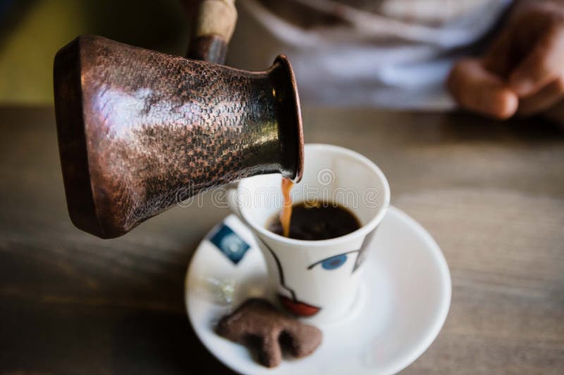 Person Hands Pouring Traditional Turkish Coffee into a Cup during a ...