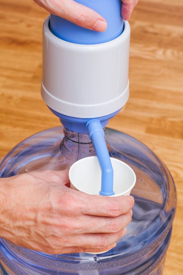 Person Hands Pouring Water in Paper Cup from Bottle with Pump Stock ...