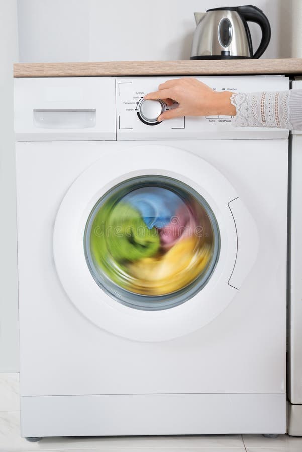 Person Hands Turning Button of Washing Machine Stock Photo - Image of ...