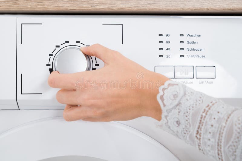 Person Hands Turning Button of Washing Machine Stock Image - Image of ...