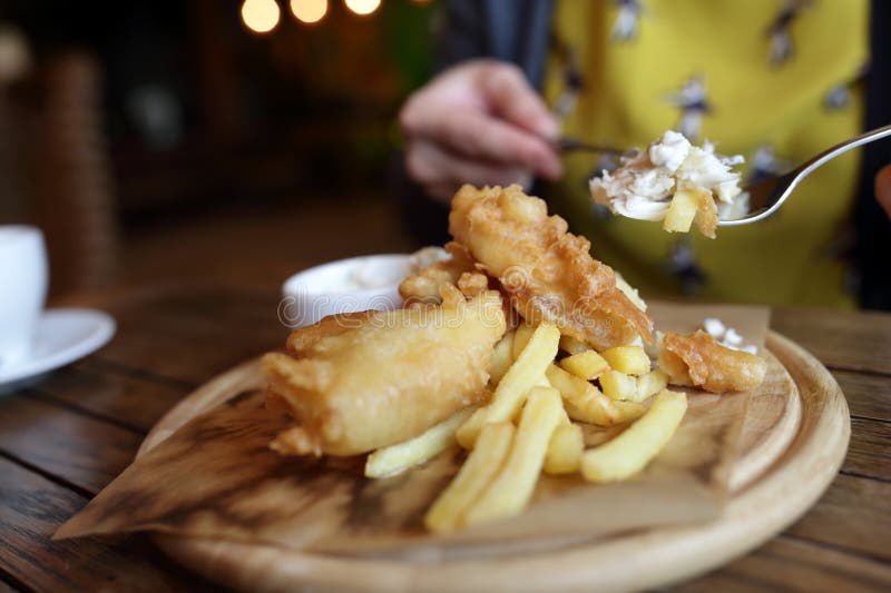 Person has fillet of cod stock image. Image of hand - 103976287