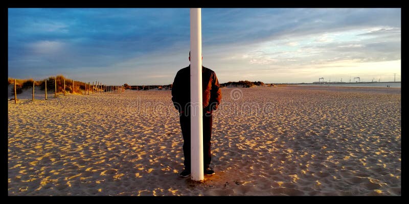 Person Hidden Behind a Pole Stock Photo - Image of enigma, white: 166431558