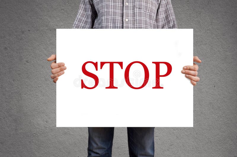 Person Holding Banner with STOP Message Stock Image - Image of paper ...