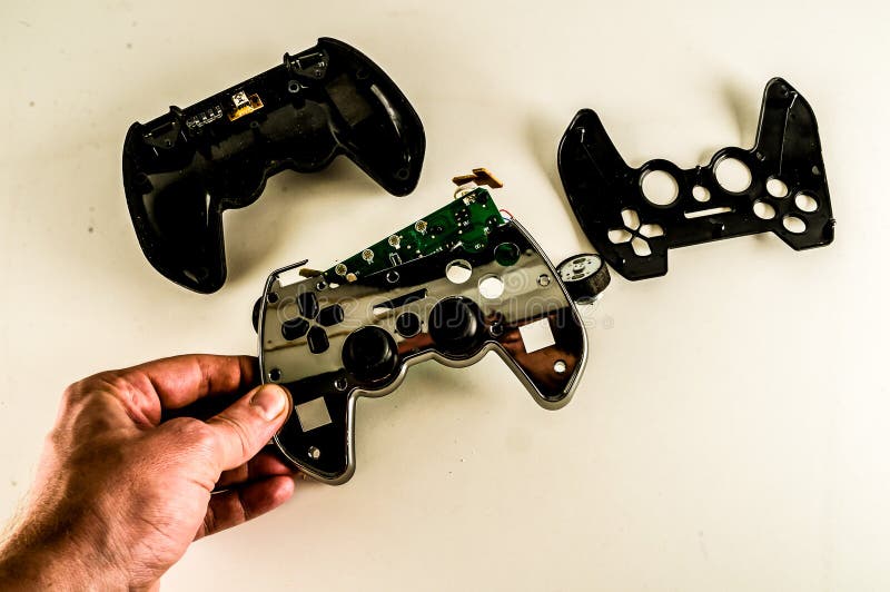 A Person is Holding a Broken Controller with a Broken Joystick Stock ...