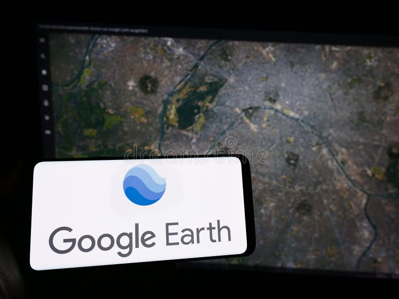Person Holding Cellphone with Logo of Satellite Imagery Software Google ...