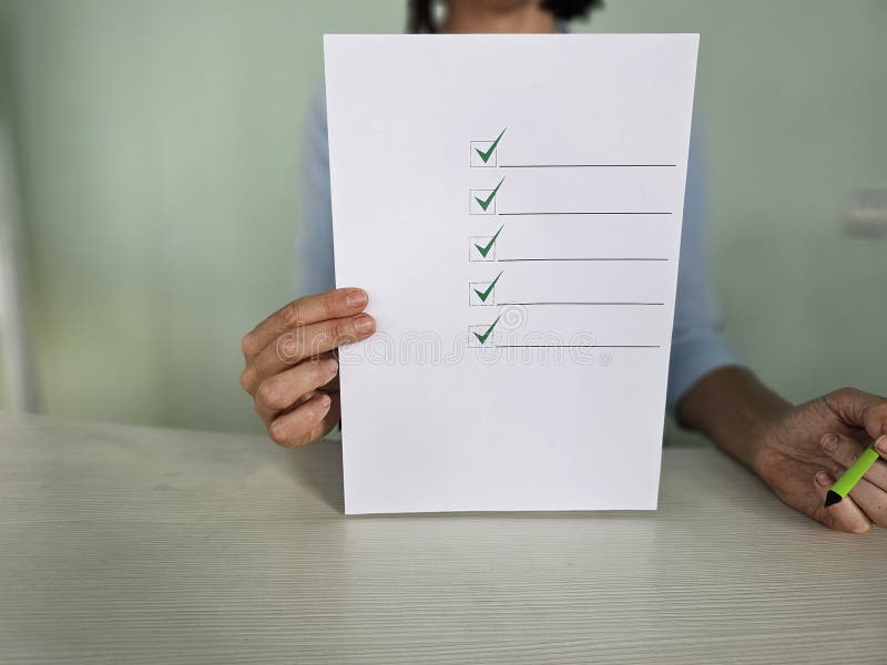 A Person Holding a Checklist with Checkmarks Stock Photo - Image of ...