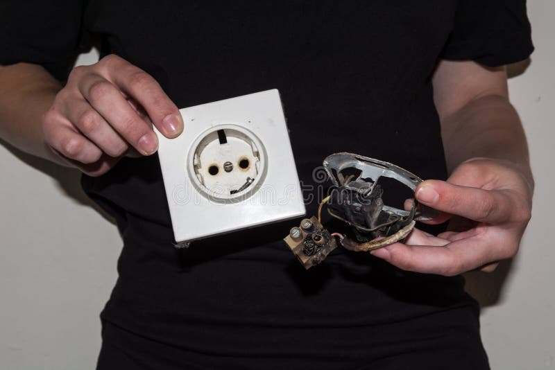 Person Holding a Damaged Electric Socket Stock Photo - Image of ...