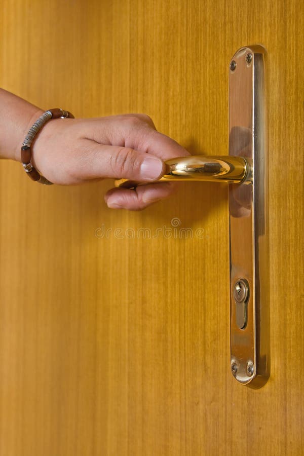 Person holding door handle stock photo. Image of opening - 10937514