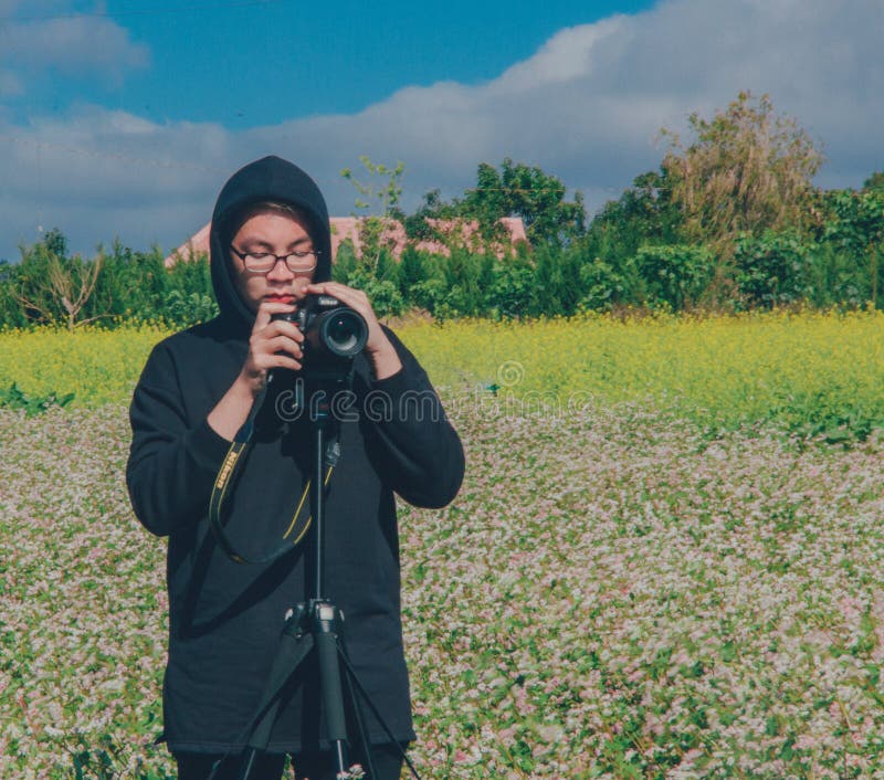 Person Holding Dslr Camera stock photo. Image of plant - 113417050