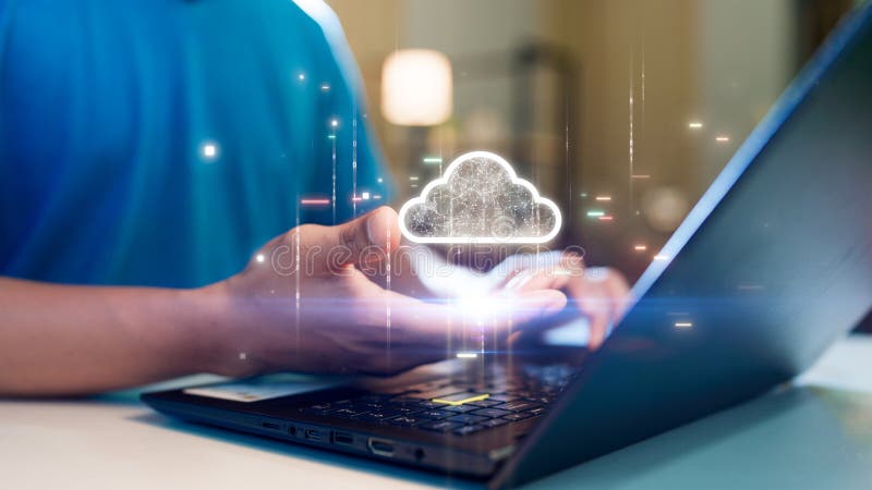 A Person Holding a Glowing Cloud Icon Above a Laptop, Symbolizing Cloud ...