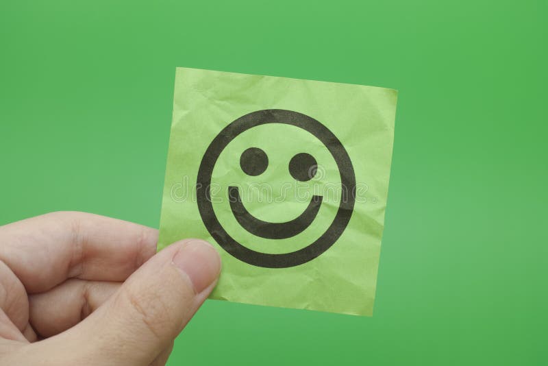 Person Holding Green Paper Note with Happy Face Stock Image - Image of ...