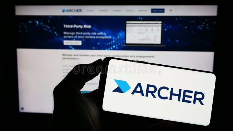 Person Holding Mobile Phone with Logo of Risk Management Software ...