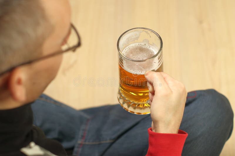 Person Holding a Mug of Beer in Front of Him Stock Image - Image of ...