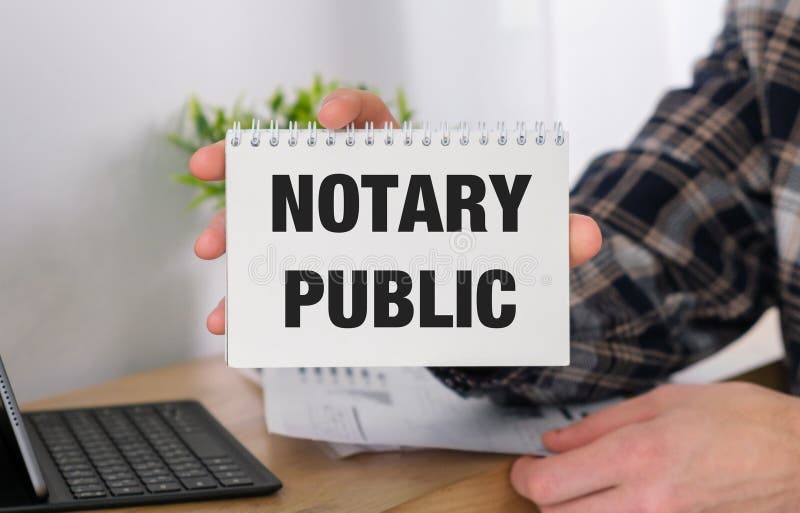 A Person is Holding a Notary Public Document. Stock Image - Image of ...