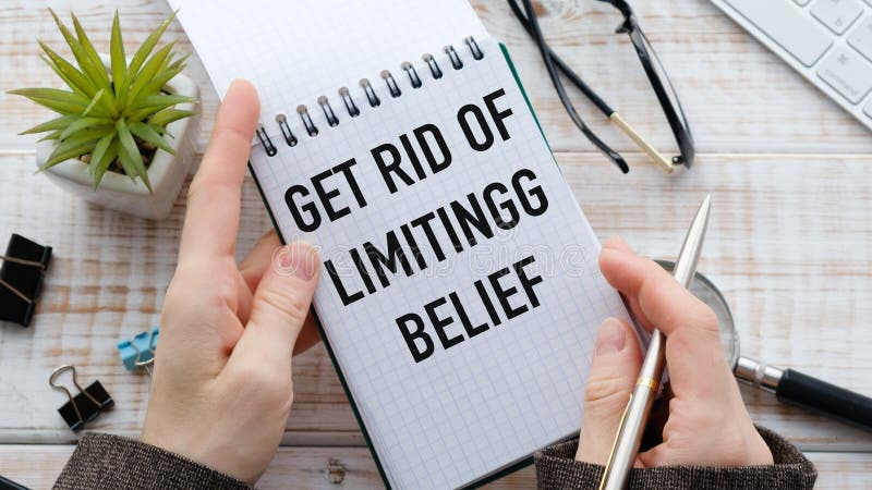 A Person is Holding a Notebook and Pen and Writing the Phrase Get Rid ...