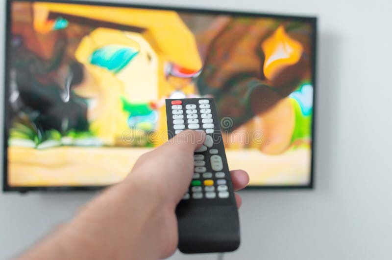 Person Holding the Remote Control or TV Remote. Remote Control in Hand ...