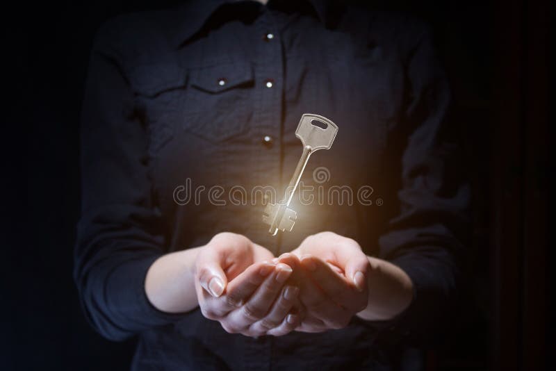 Person holding shining key stock photo. Image of company - 68046038