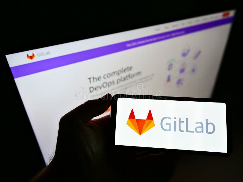 Person Holding Smartphone with Logo of US DevOps Platform GitLab Inc ...