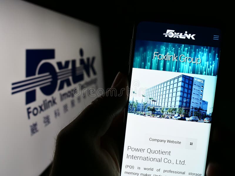Person Holding Smartphone with Webpage of Company Foxlink Image ...