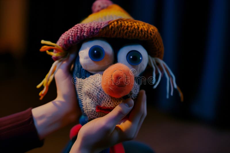 Person Holding a Sock Puppet with Comically Large Eyes and a Funny Hat ...
