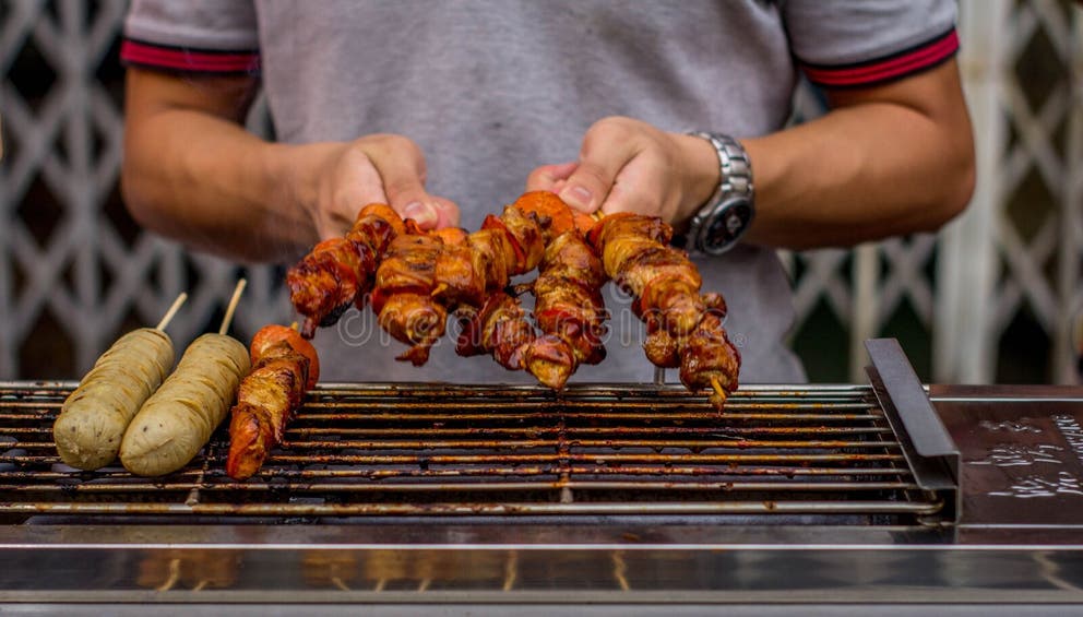 Person Holding Some Satay Sticks for Roasting Stock Photo - Image of ...