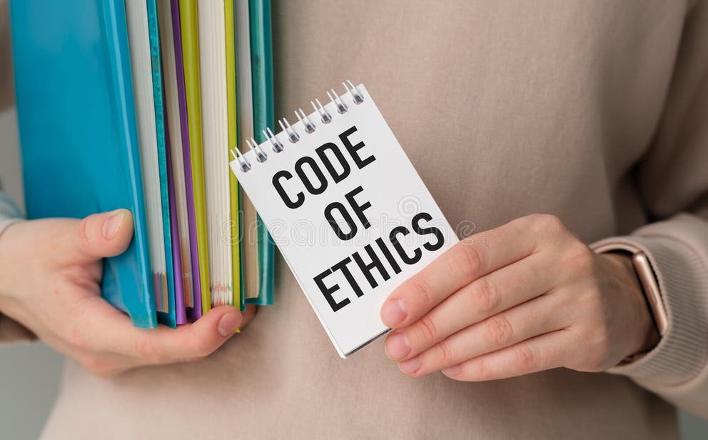 A Person is Holding a Stack of Books and a Spiral Bound Notebook with ...