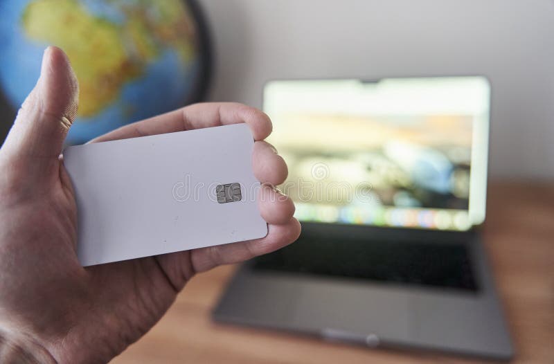 Person Holds Credit Card in Front of Computer for Online Transaction ...