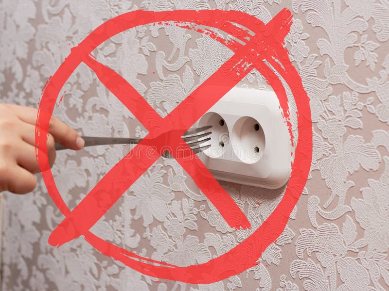 The Person Inserting the Plug into an Electrical Socket is Dangerous ...