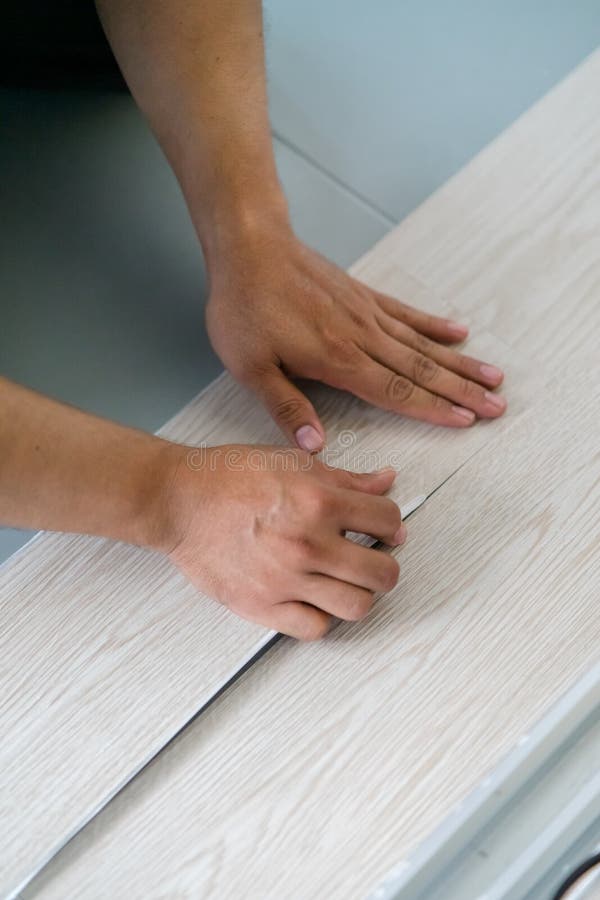 A Person Installing New Vinyl Tile Floor, a DIY Home Project Stock ...